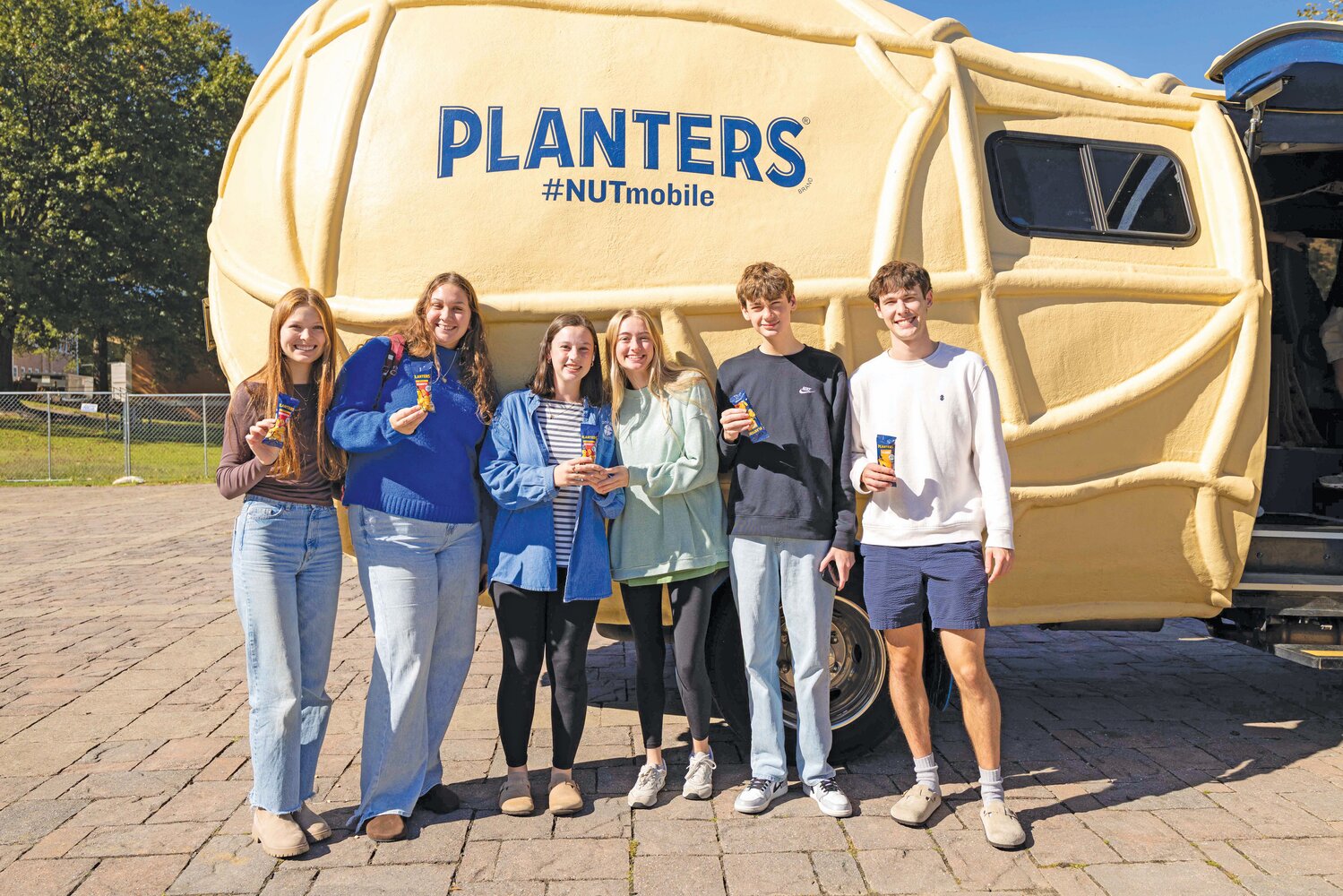 FHU alumna Adleigh Mayes cracks open the NUTmobile on the Henderson ...